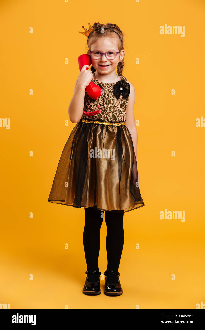 Picture of happy girl child wearing princess crown standing isolated ...