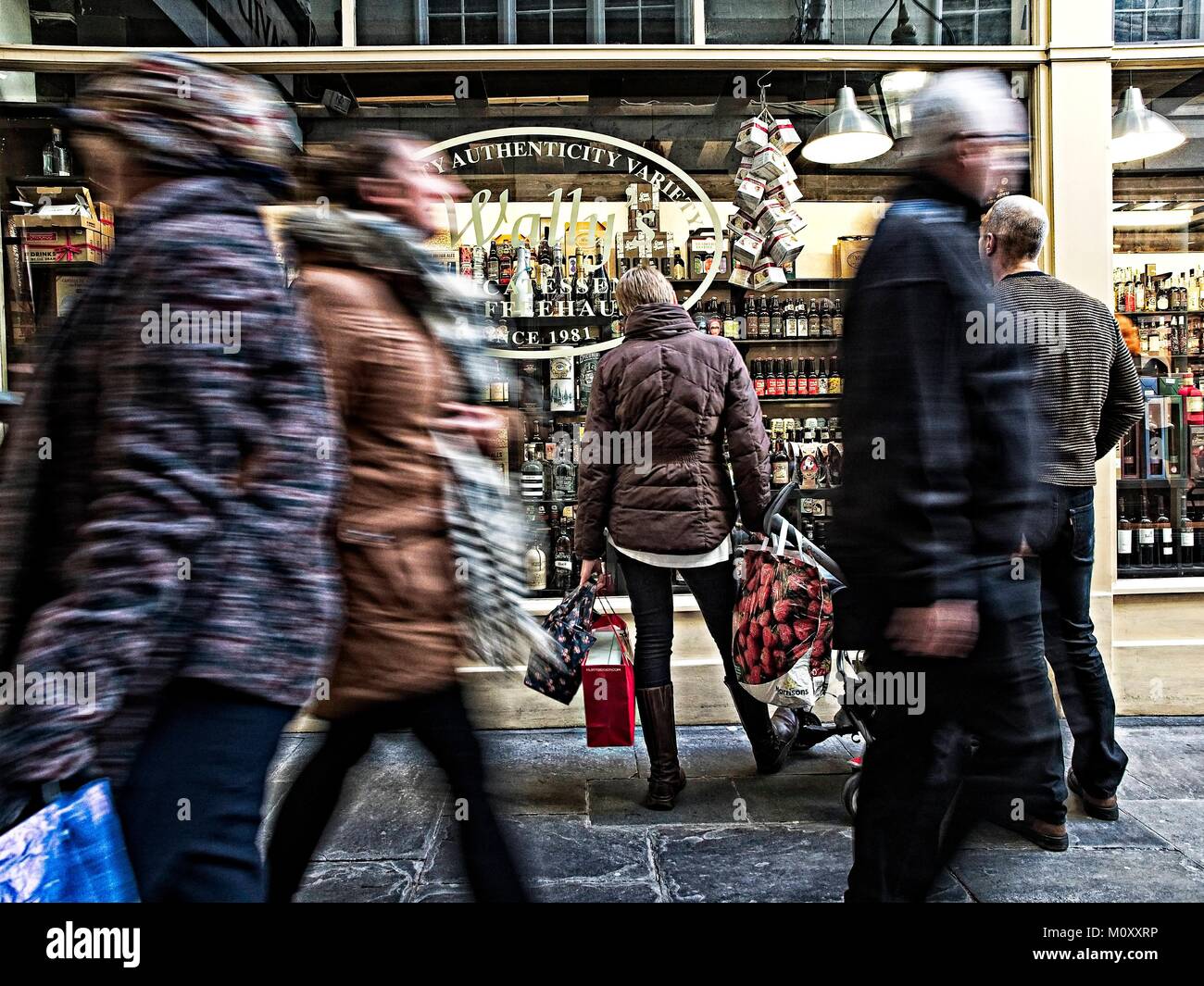 Woman shopping. Looking through the window of Wally's Delicatessen, The ...