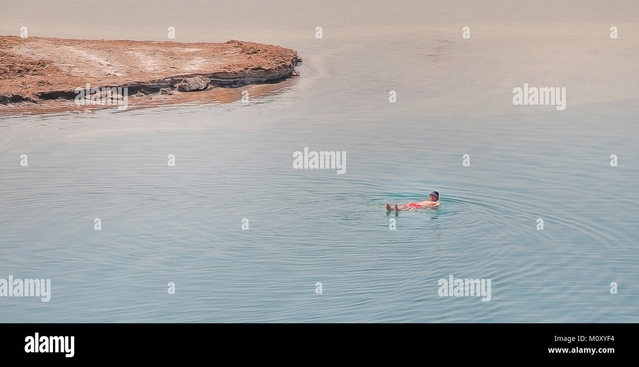 Floating in the dead sea hi-res stock photography and images - Alamy