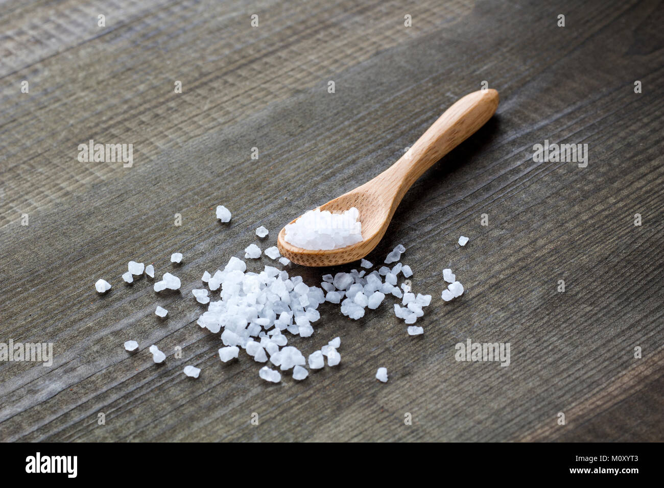 salt crystals with wooden spoon Stock Photo - Alamy