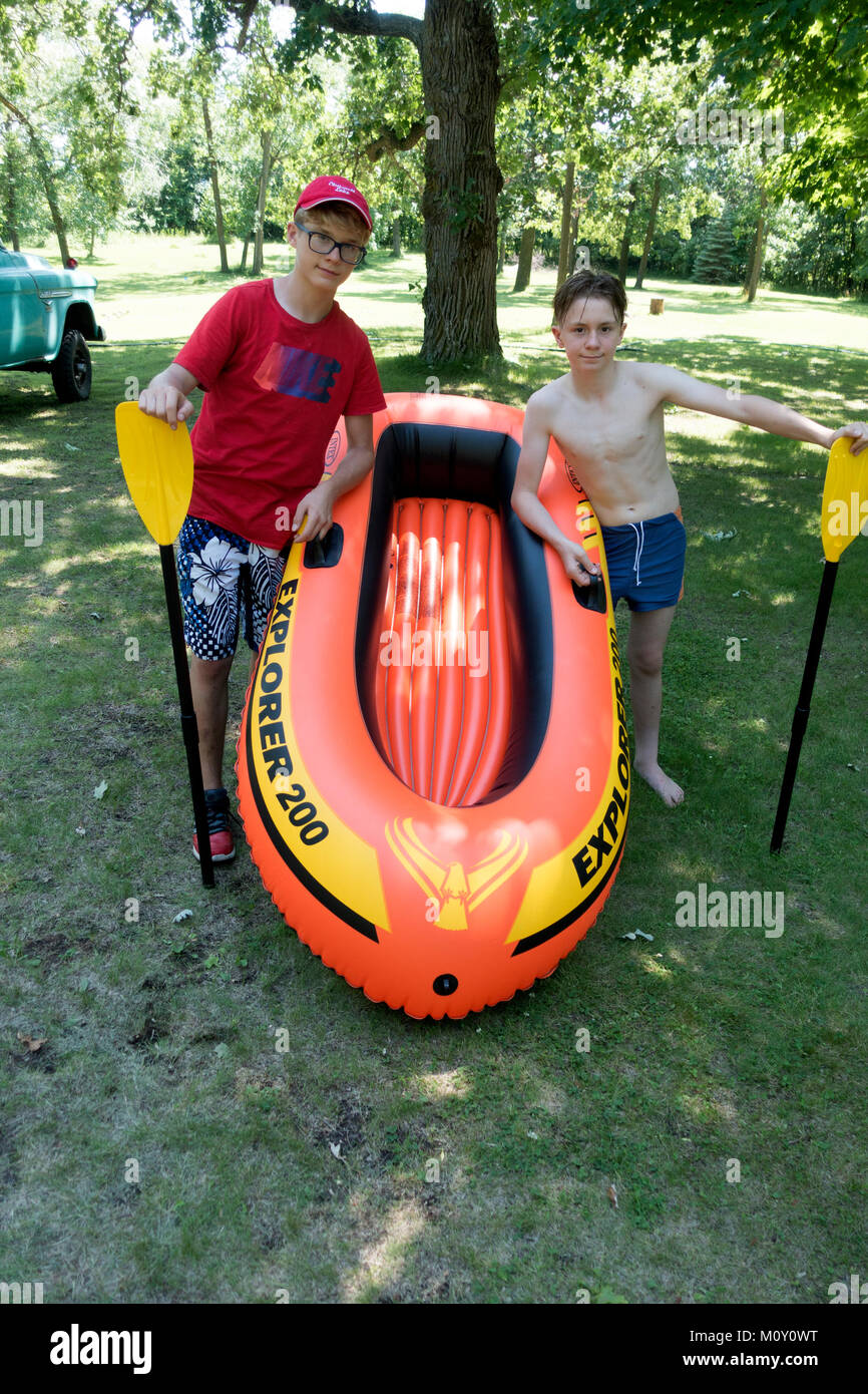 My two grandsons holding paddles ready to launch their new "Intex ...