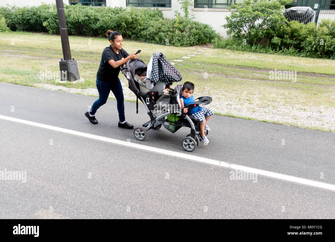 Pushing stroller hi-res stock photography and images - Alamy
