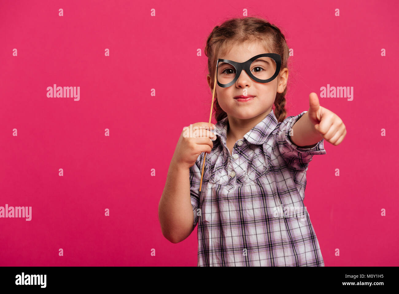 Picture of cheerful little girl child standing isolated over pink ...