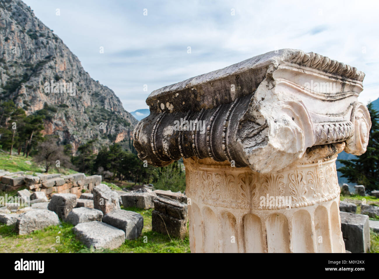 Fragment of column in the excavation sight of ancient town of Delphi ...