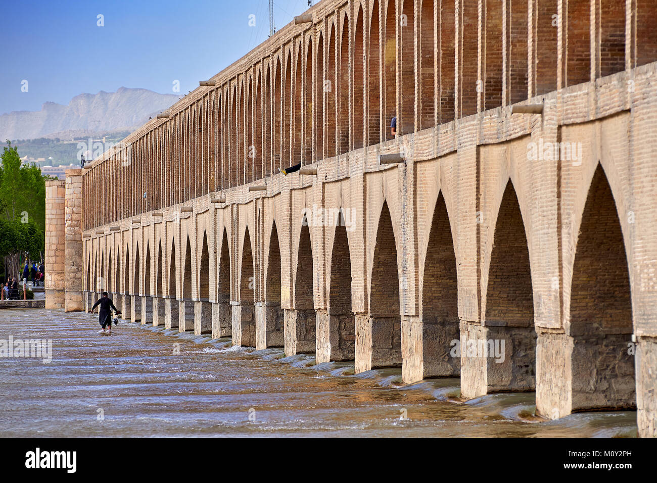 Isfahan, Iran - April 24, 2017: An Iranian man crosses the Zayandeh ...