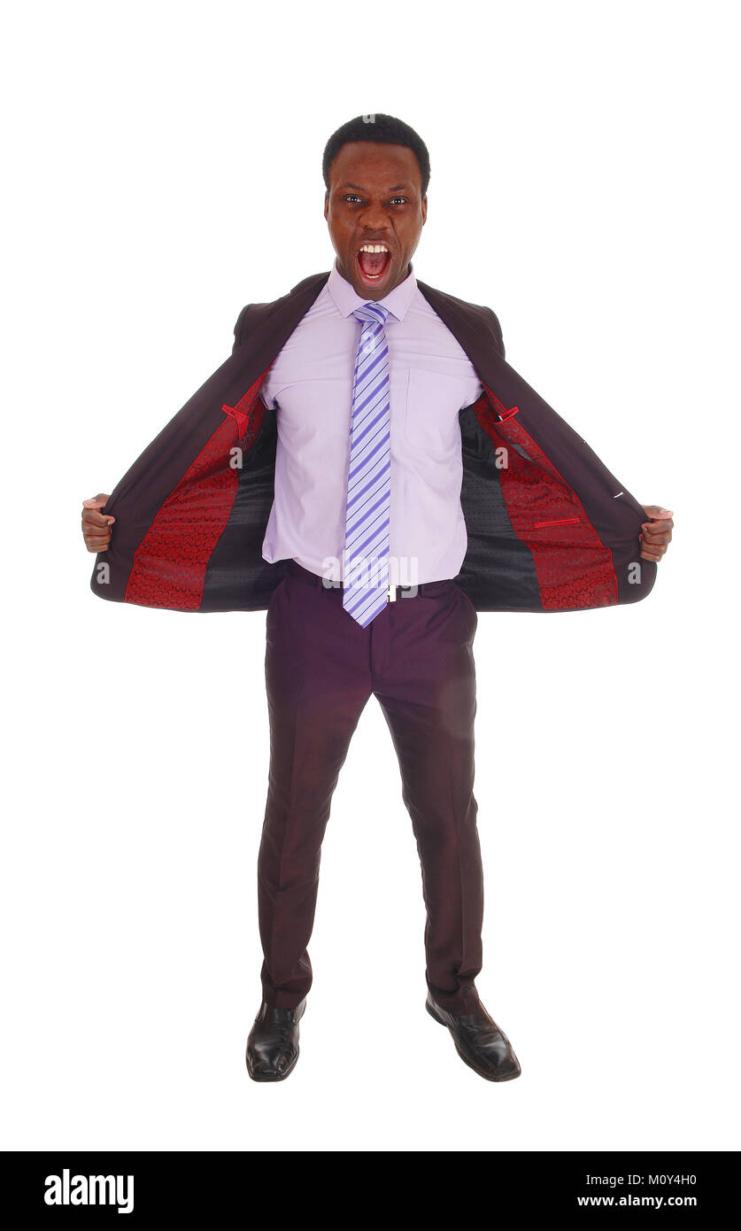 A tall handsome African American man standing in a suit and tie with ...