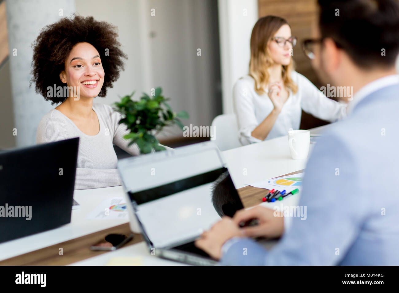 business people around table during staff meeting in the office Stock ...