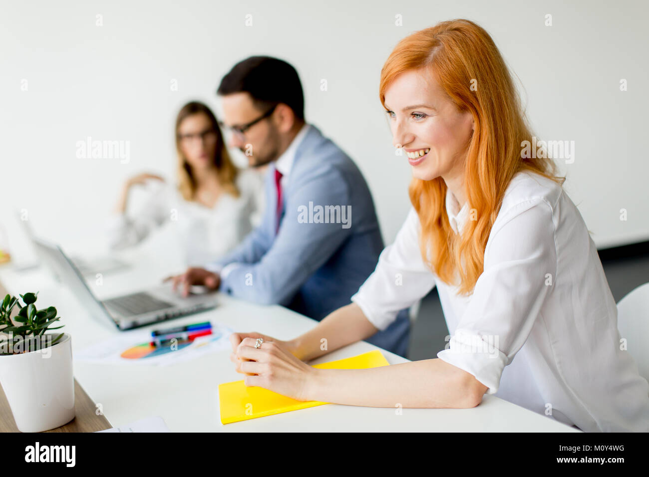 business people around table during staff meeting in the office Stock ...
