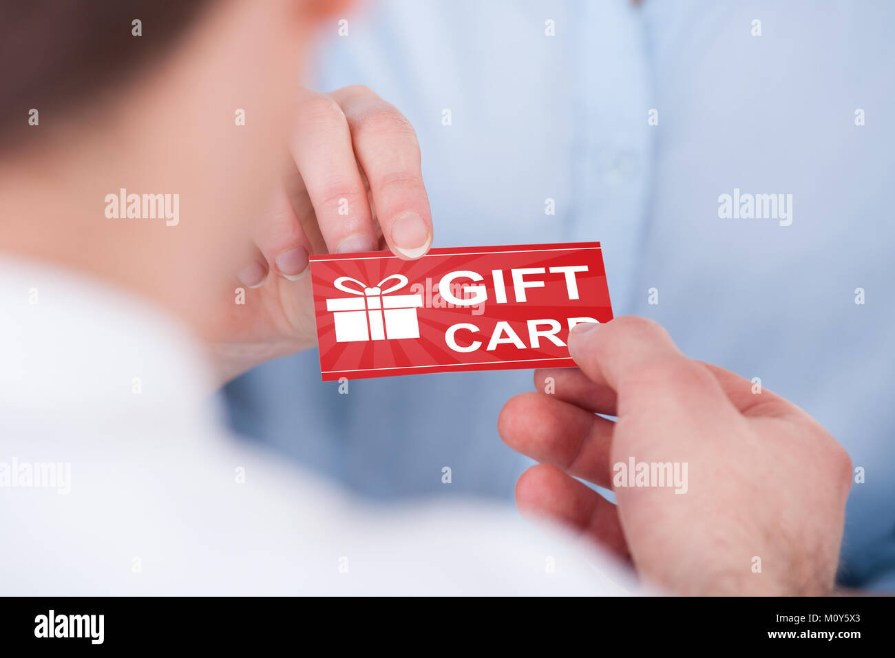 Two hands holding gift hi-res stock photography and images - Alamy