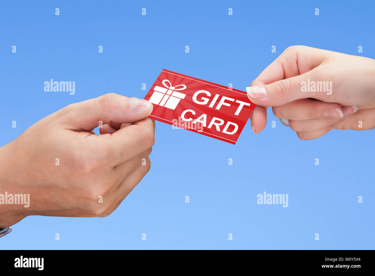 Close-up Of Two Hands Holding Gift Card Stock Photo - Alamy