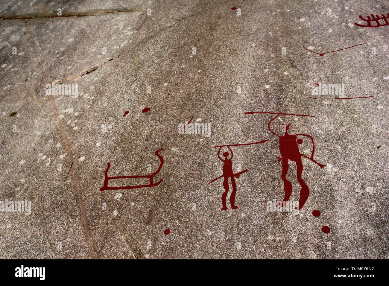 A prehistorical painting with hunting men. The drawing was made a long ...