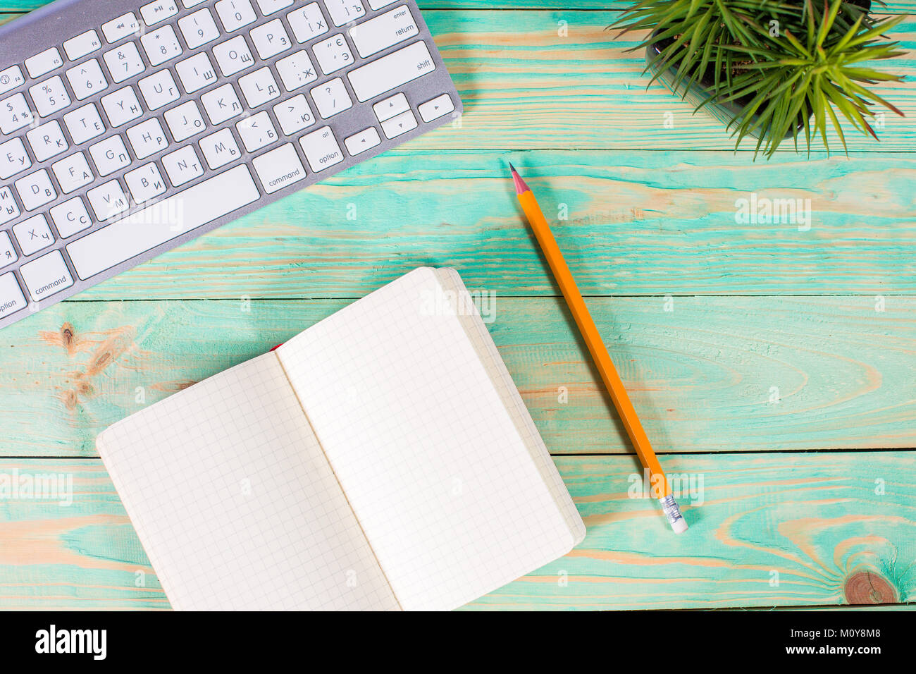 Modern green wooden office desk with laptop computer Stock Photo - Alamy