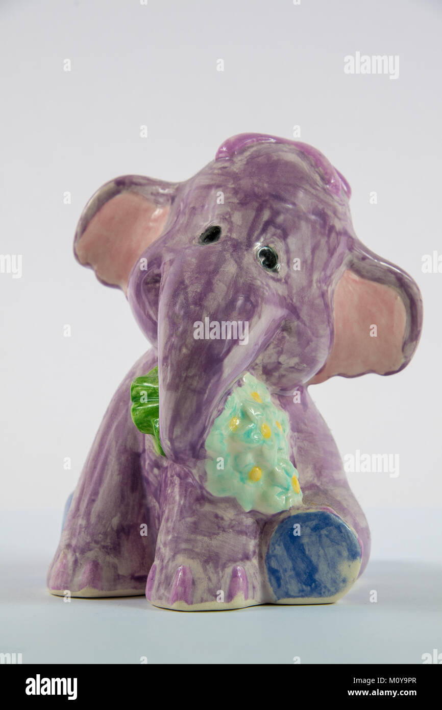 Homemade ceramic elephant on a white background Stock Photo - Alamy