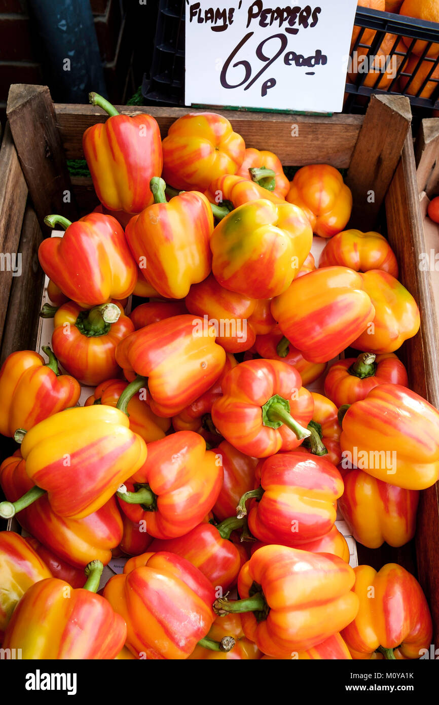 Colourful red and yellow Flame Peppers on display outside a ...