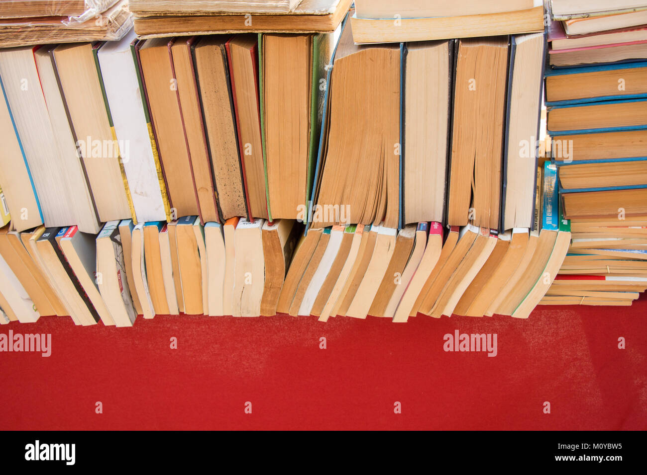 Book pages partly in view on white background Stock Photo - Alamy