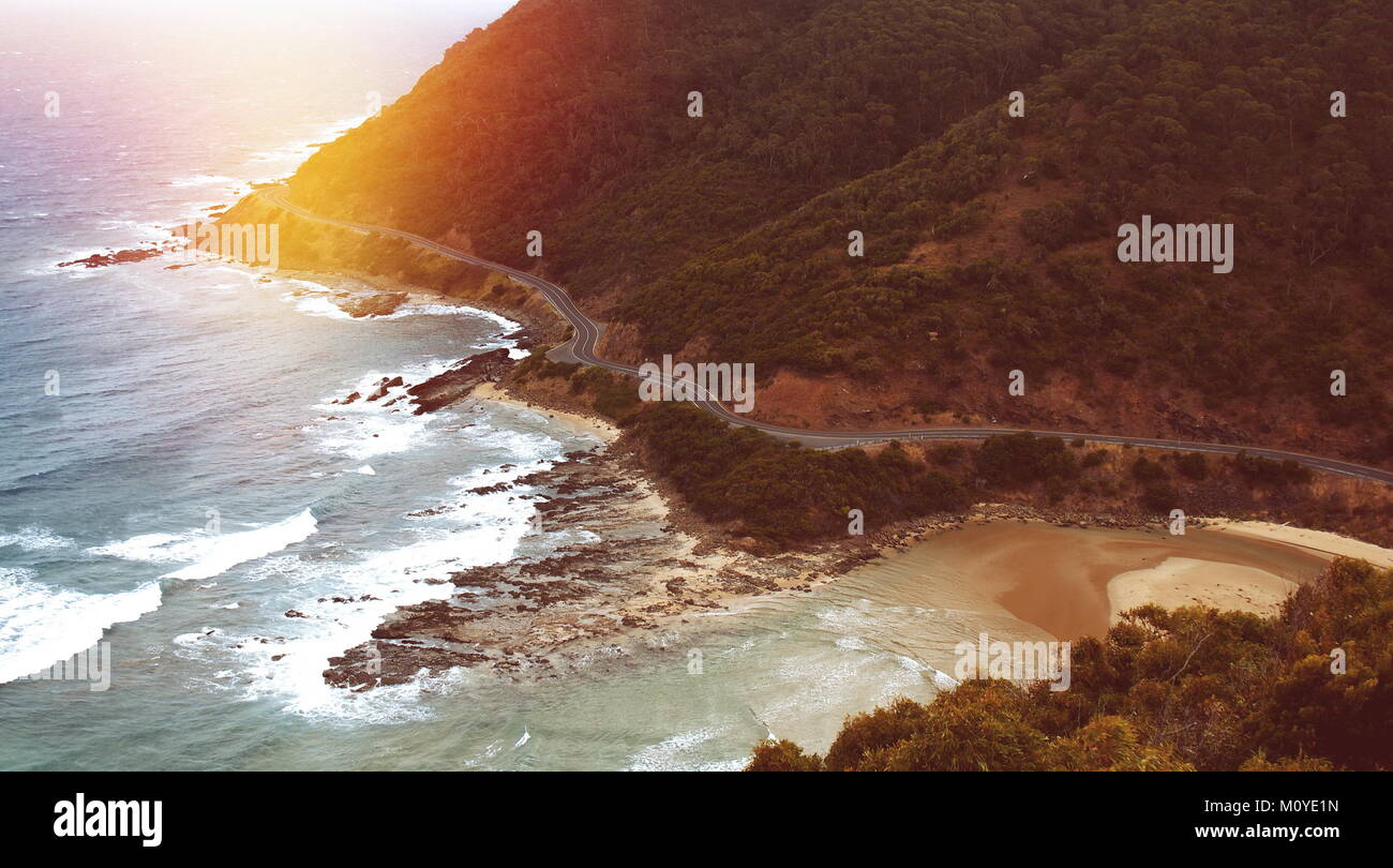 Ocean road in sunset Stock Photo - Alamy