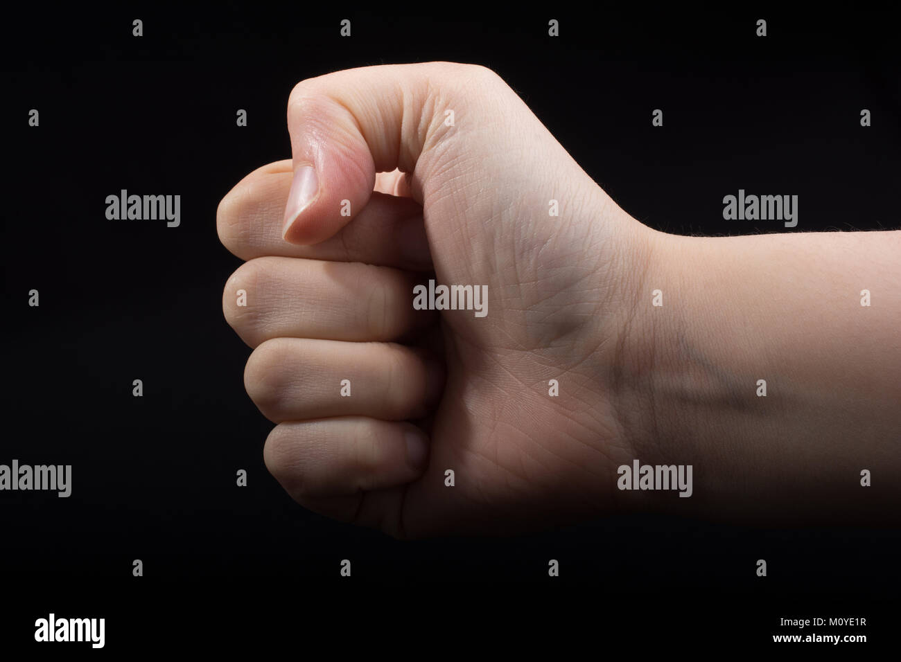 Hand closed for a fist gesture in black Stock Photo - Alamy