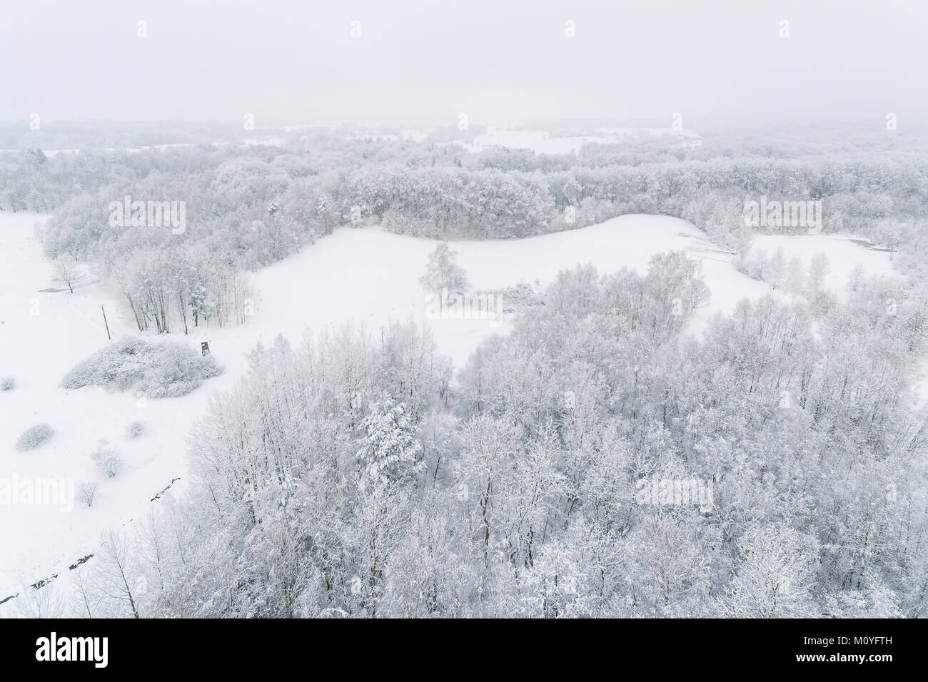 Aerial: Snow-covered countryside in winter Stock Photo - Alamy