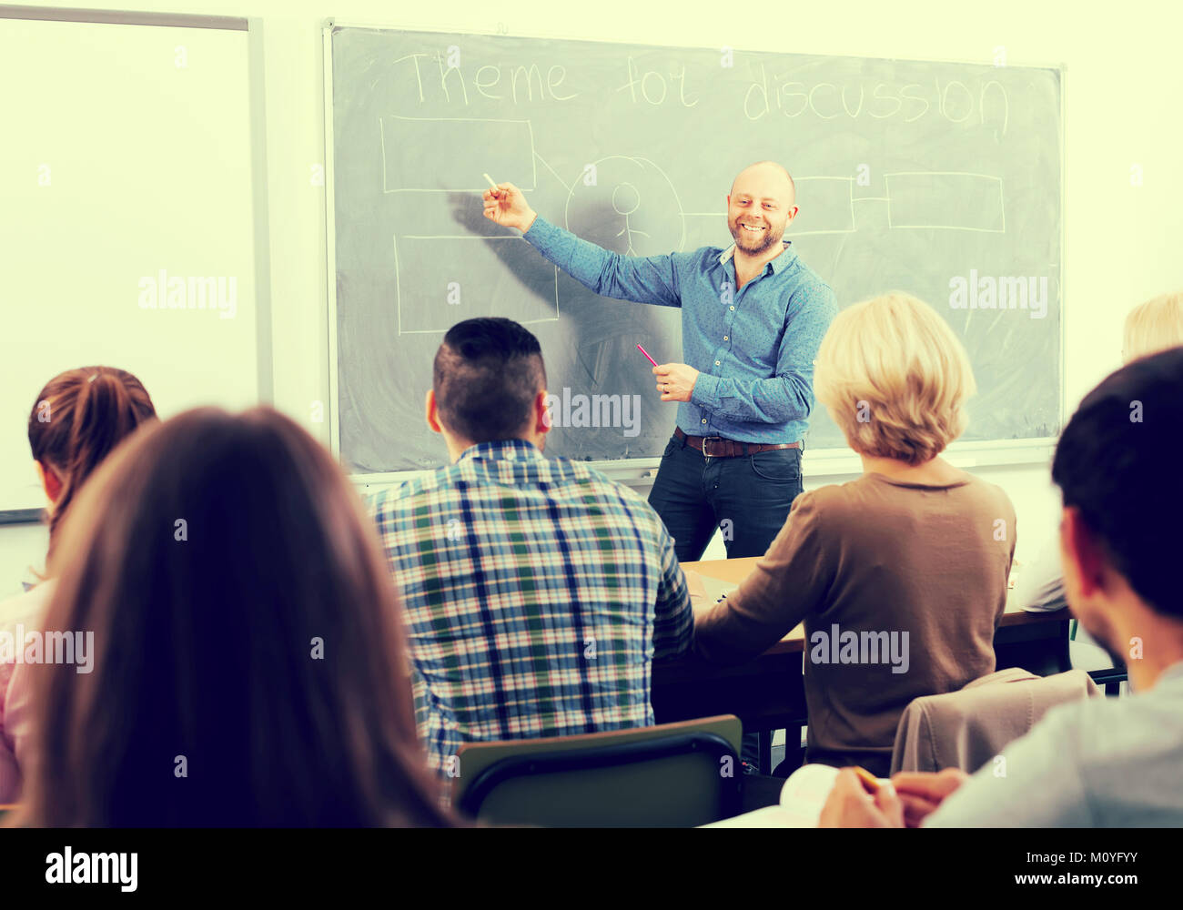 Professor teaching different age students at extension courses Stock ...