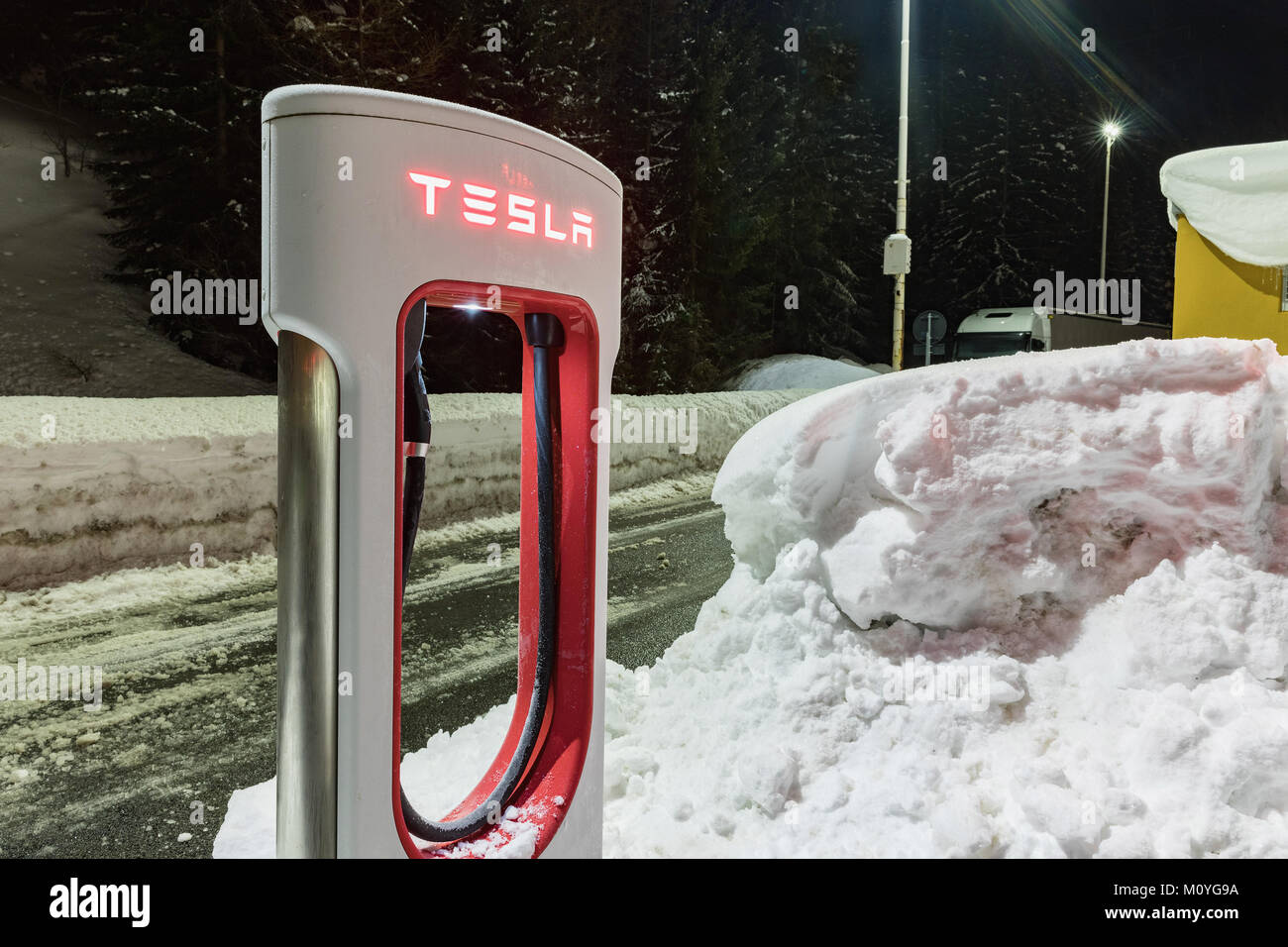 BRENNER, ITALY - JANUARY, 24, 2018: Tesla supercharger in winter under ...