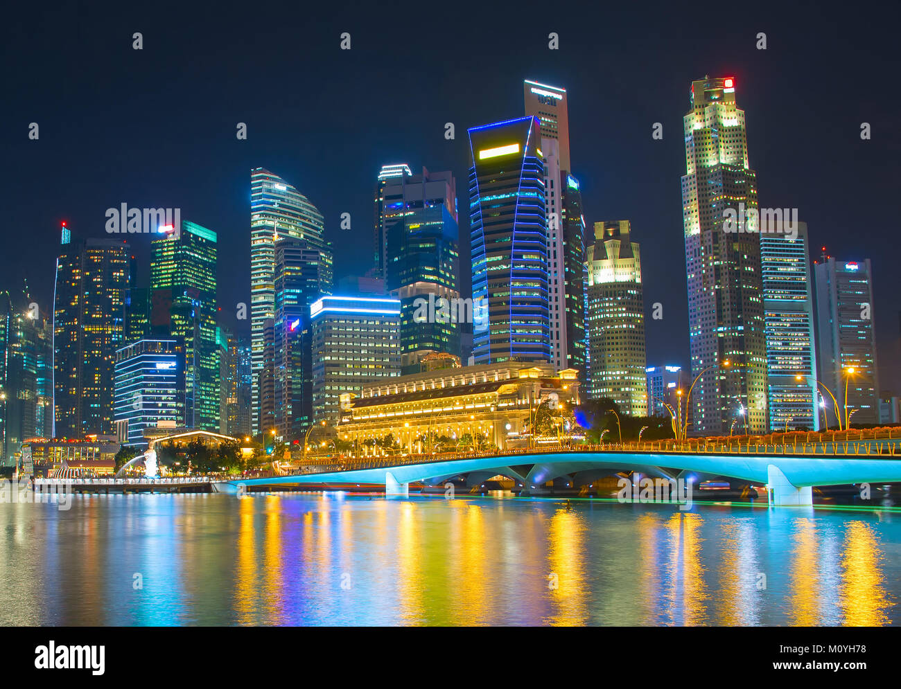 View of Singapore Downtown Core reflecting in a river at night Stock ...