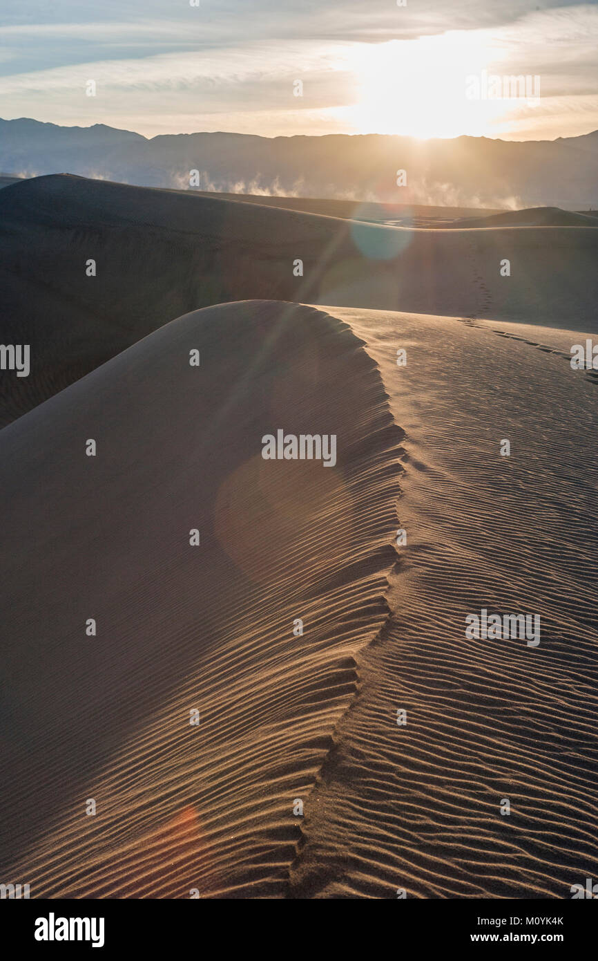 Sunset on sand dunes Stock Photo - Alamy