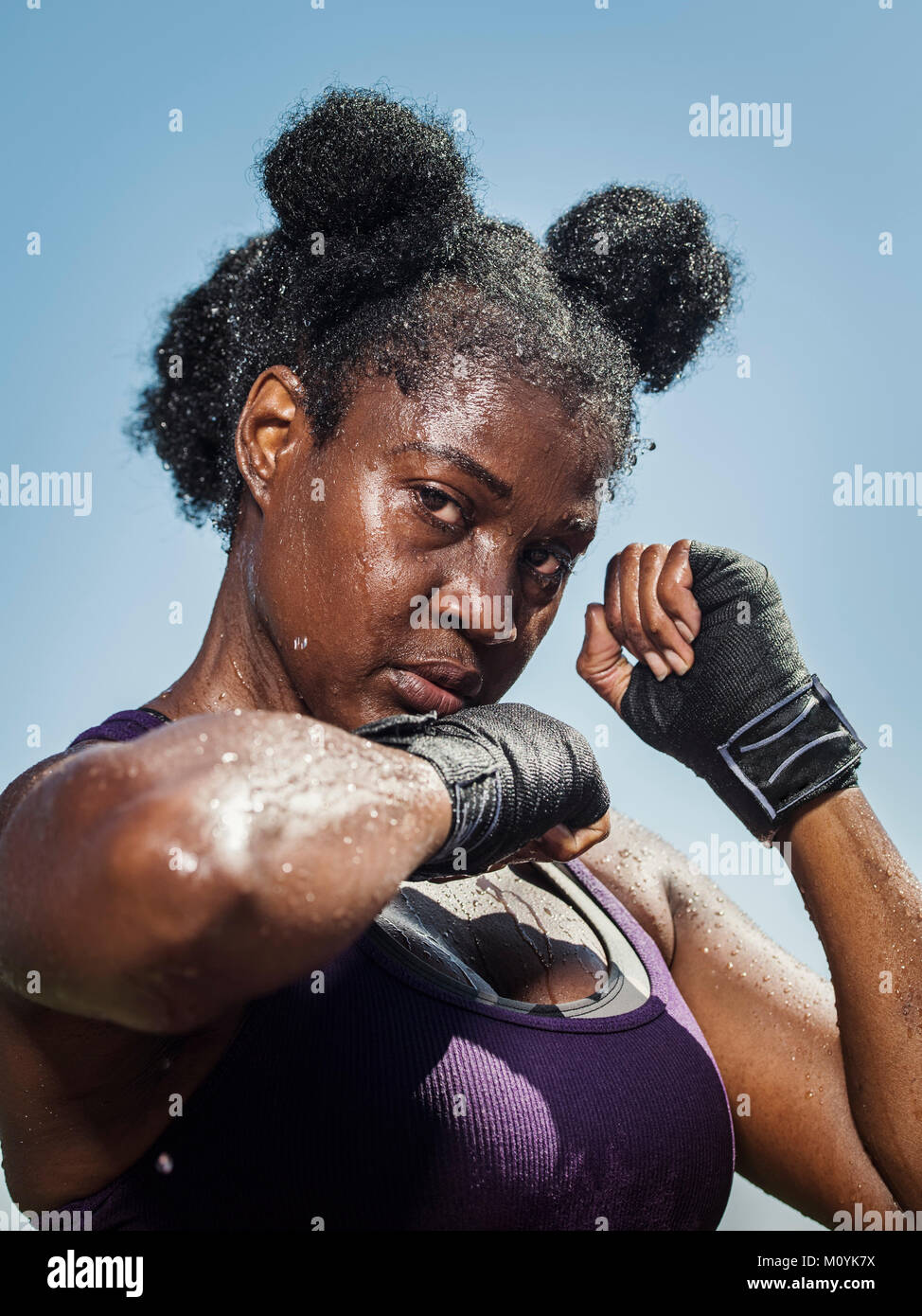 Portrait of black woman with hands wrapped for boxing Stock Photo - Alamy