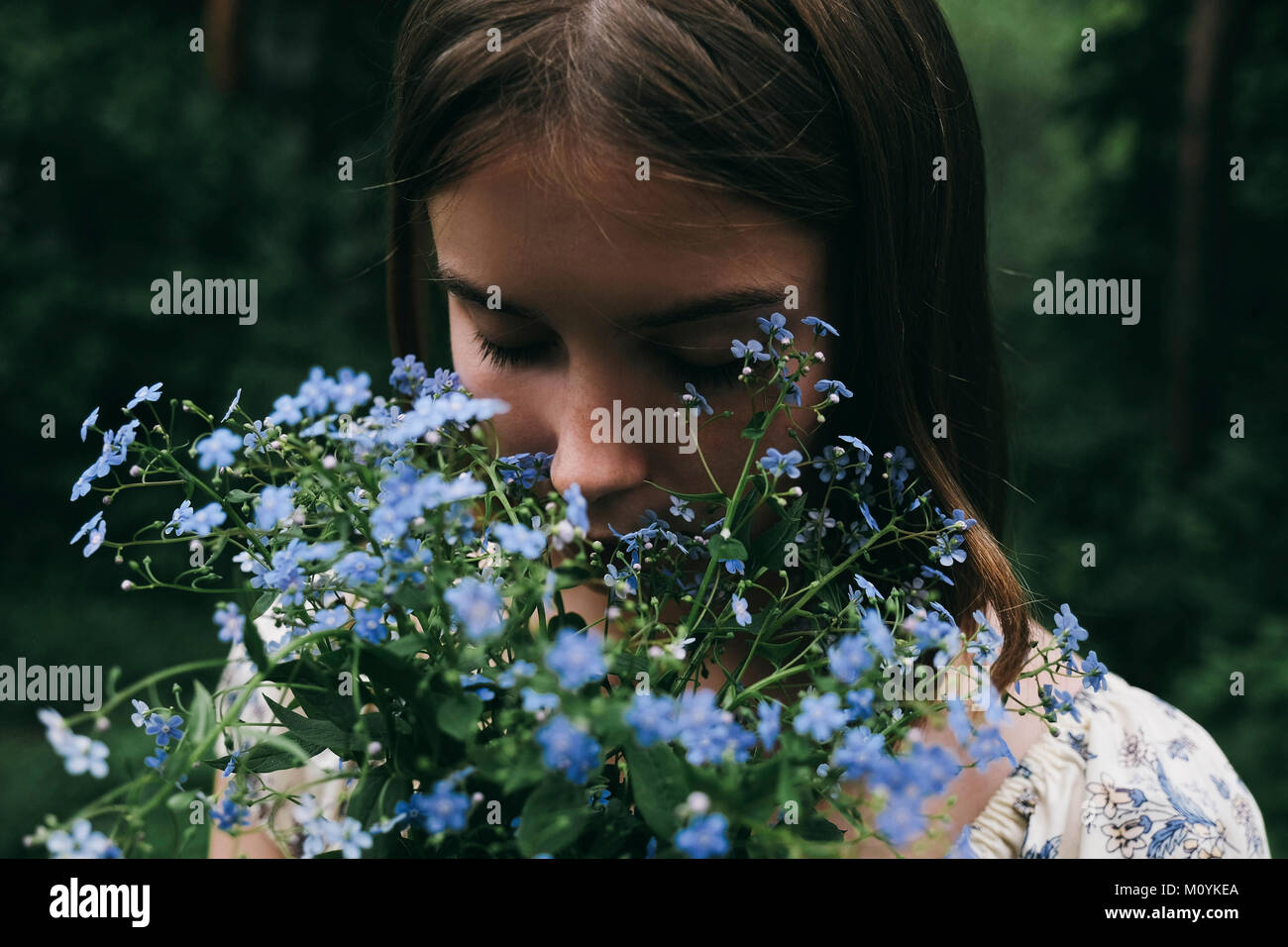 Asian woman smelling flower hi-res stock photography and images - Alamy