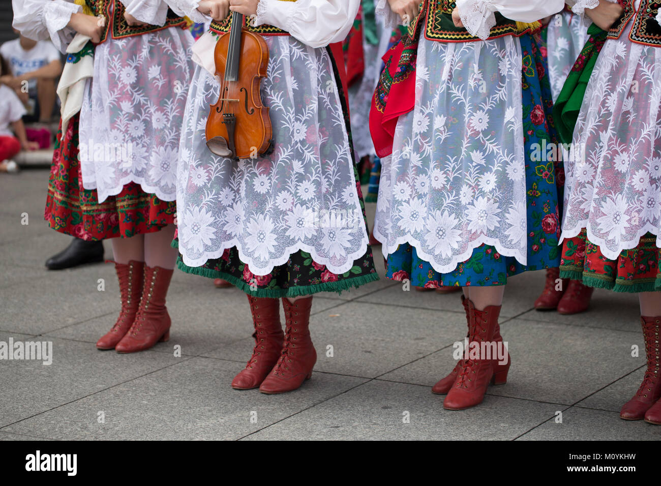 Polish folk dance group with traditional costume and a violin Stock ...