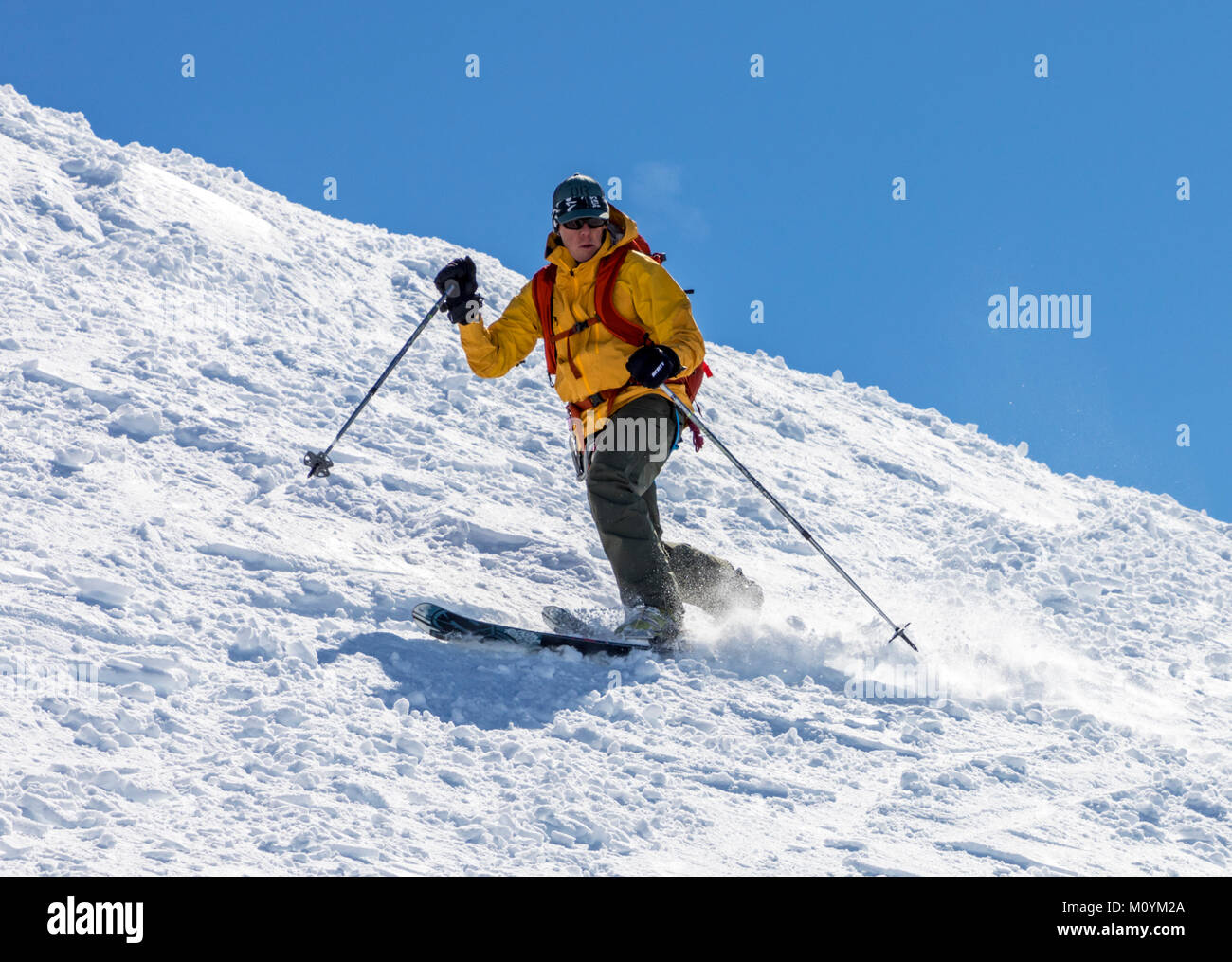 Alpine telemark ski mountaineer skiing downhill in Antarctica; Nansen ...