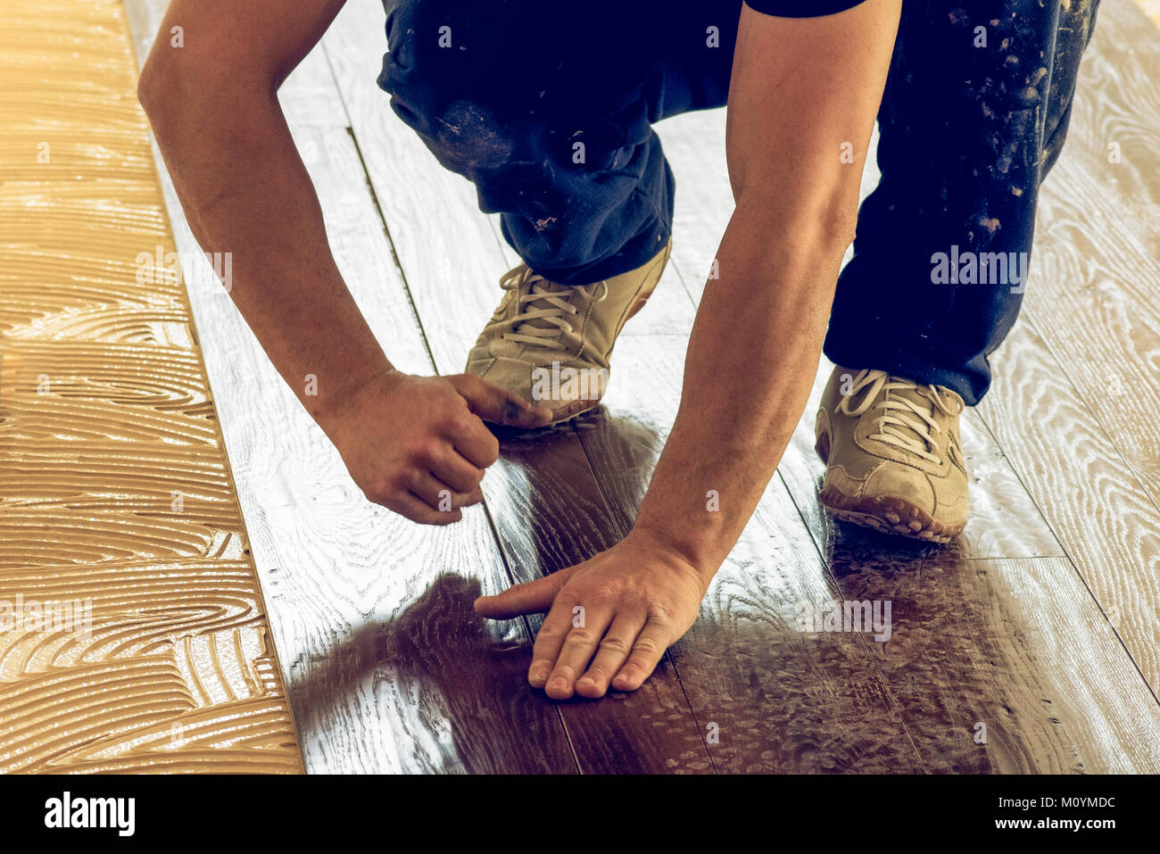 Parquet installation with glue Stock Photo - Alamy