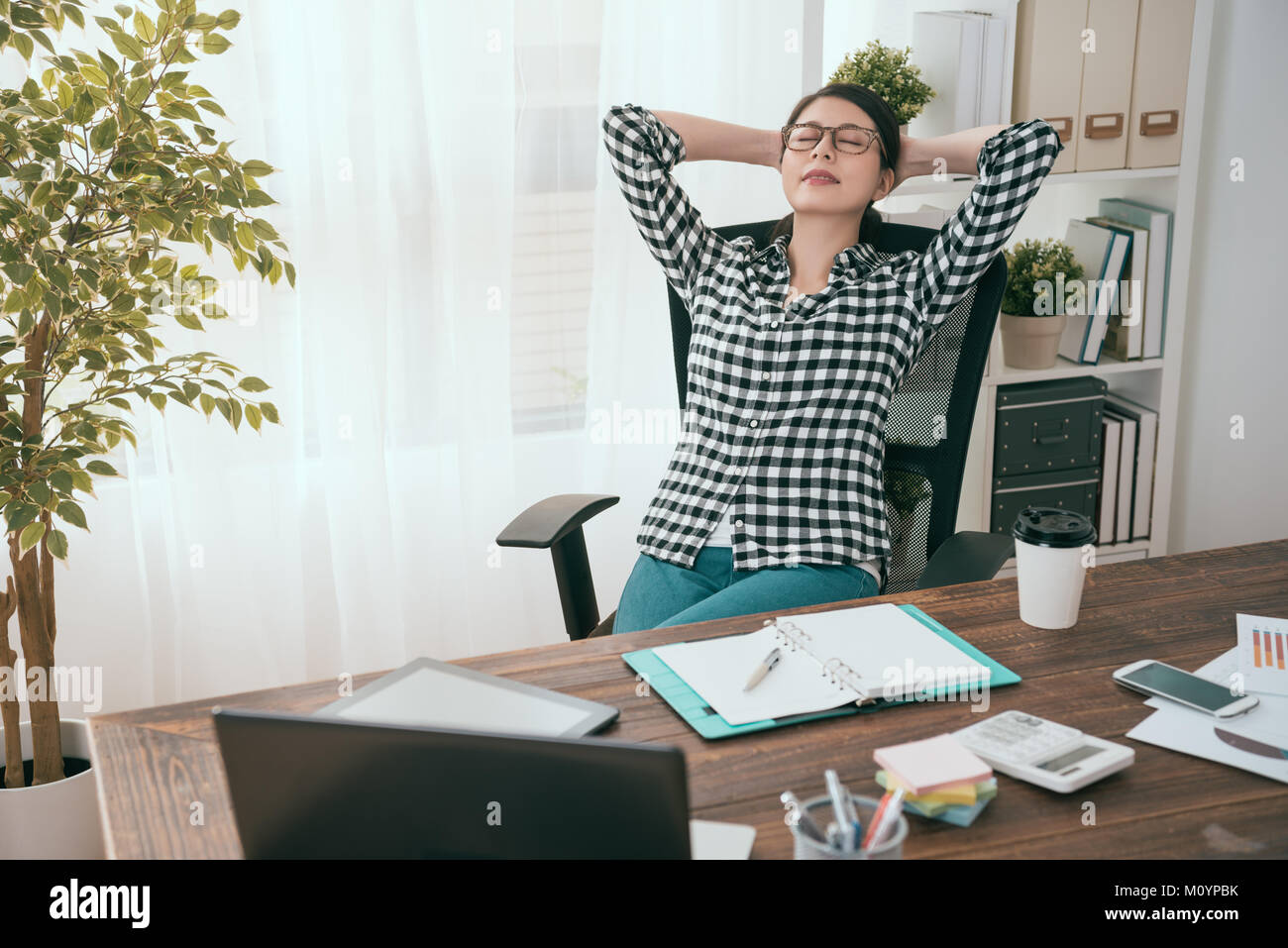 Businesswoman sleeping on chair hi-res stock photography and images - Alamy