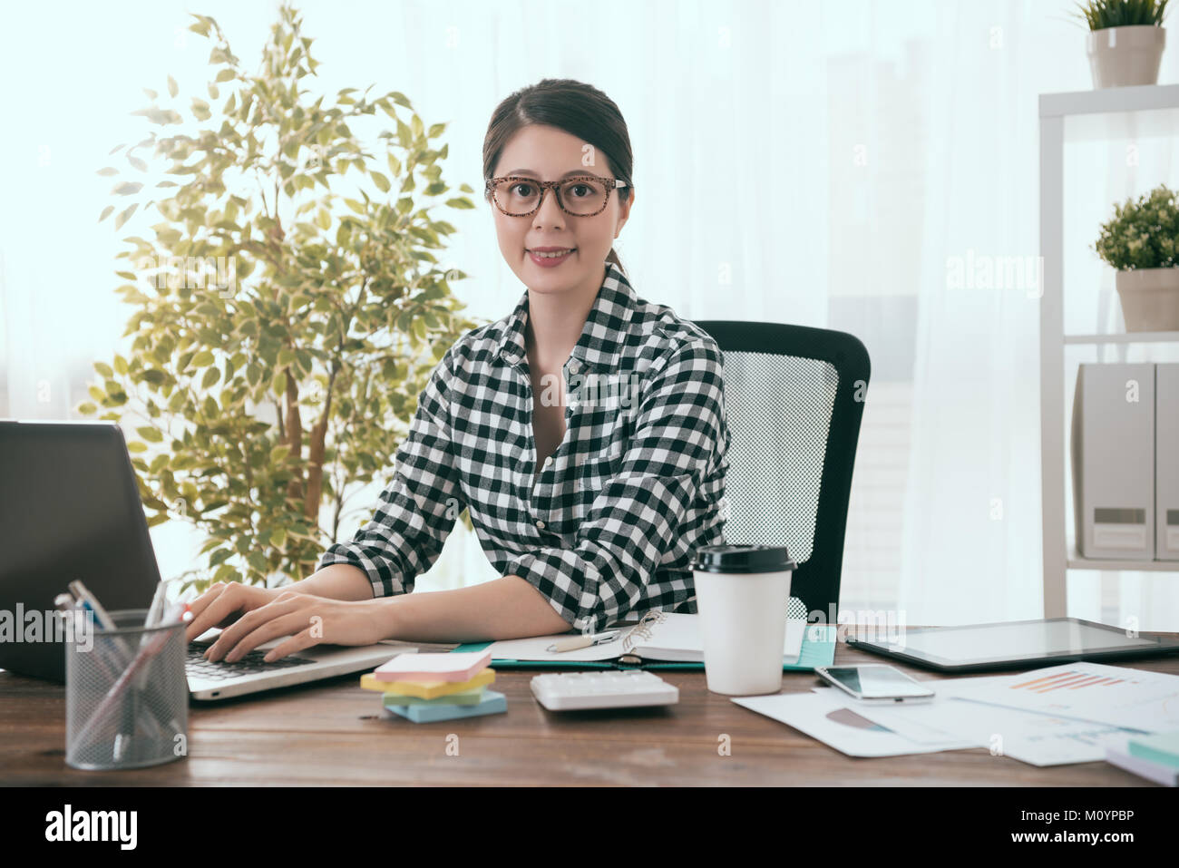 confident happy female office worker doing company work at home and ...