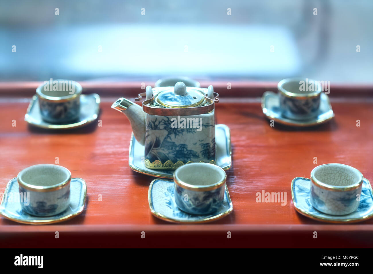 Set of teapots and the old tea cup on the table exhibited as old ...