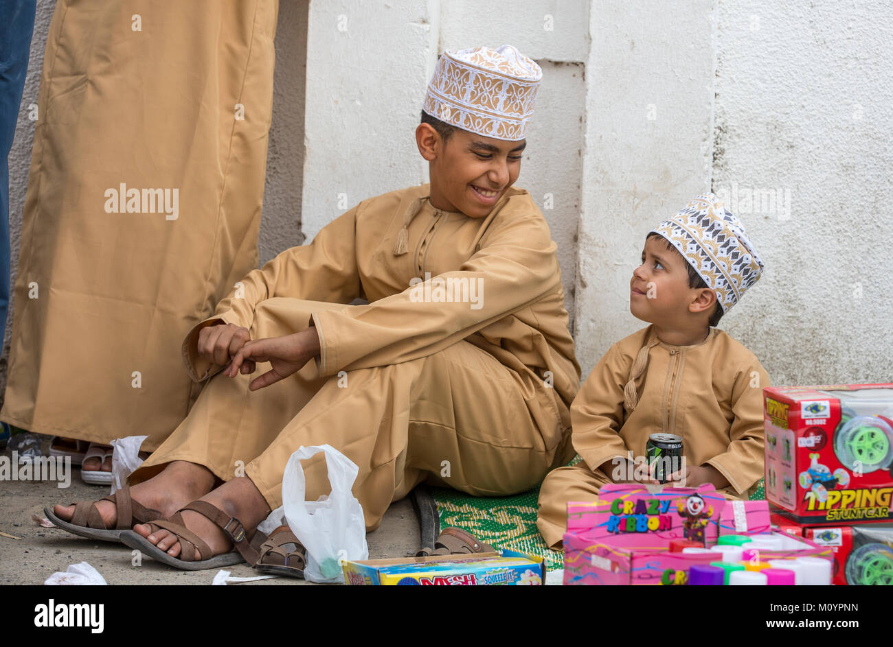 Nizwa, Oman - June 26th 2017: children selling toys at a toy market on ...