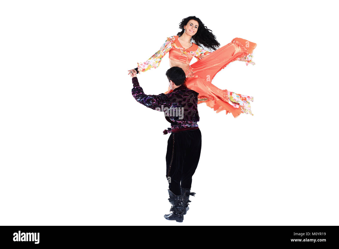 dancing couple, in the national Gypsy costumes performing folk dance ...