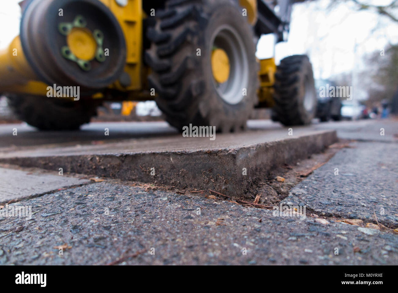 A pavement flagstone / concrete flag which has moved under the weight ...