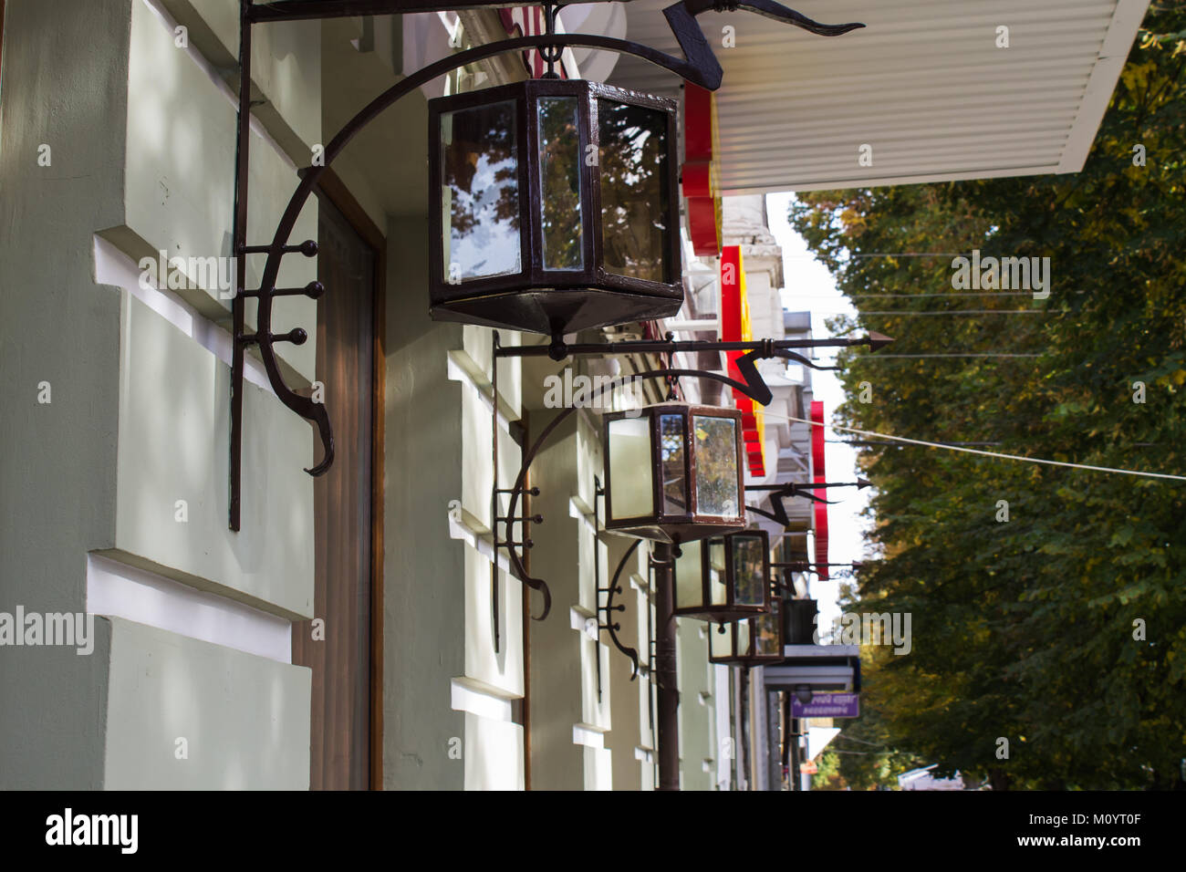 series lanterns on a building facade closeup Stock Photo - Alamy