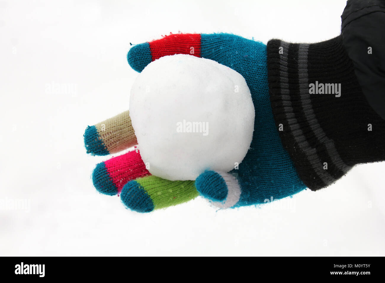 Snowball in hand Stock Photo - Alamy
