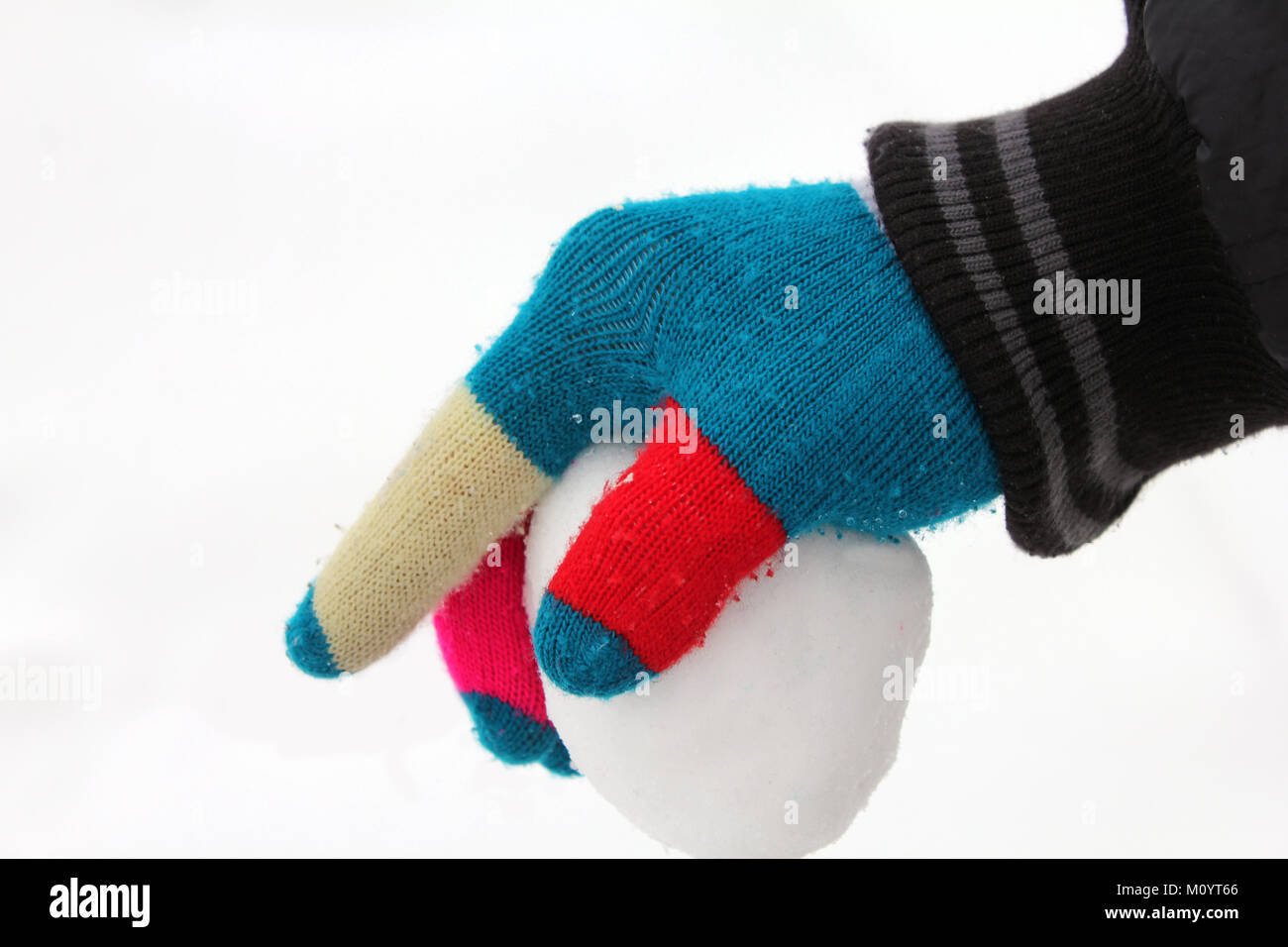 Snowball in hand Stock Photo - Alamy
