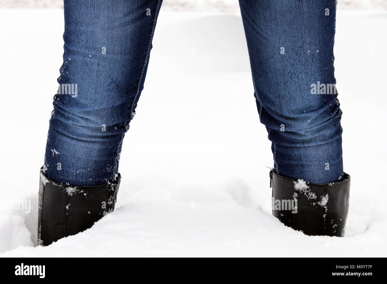 Woman's legs in snow Stock Photo - Alamy