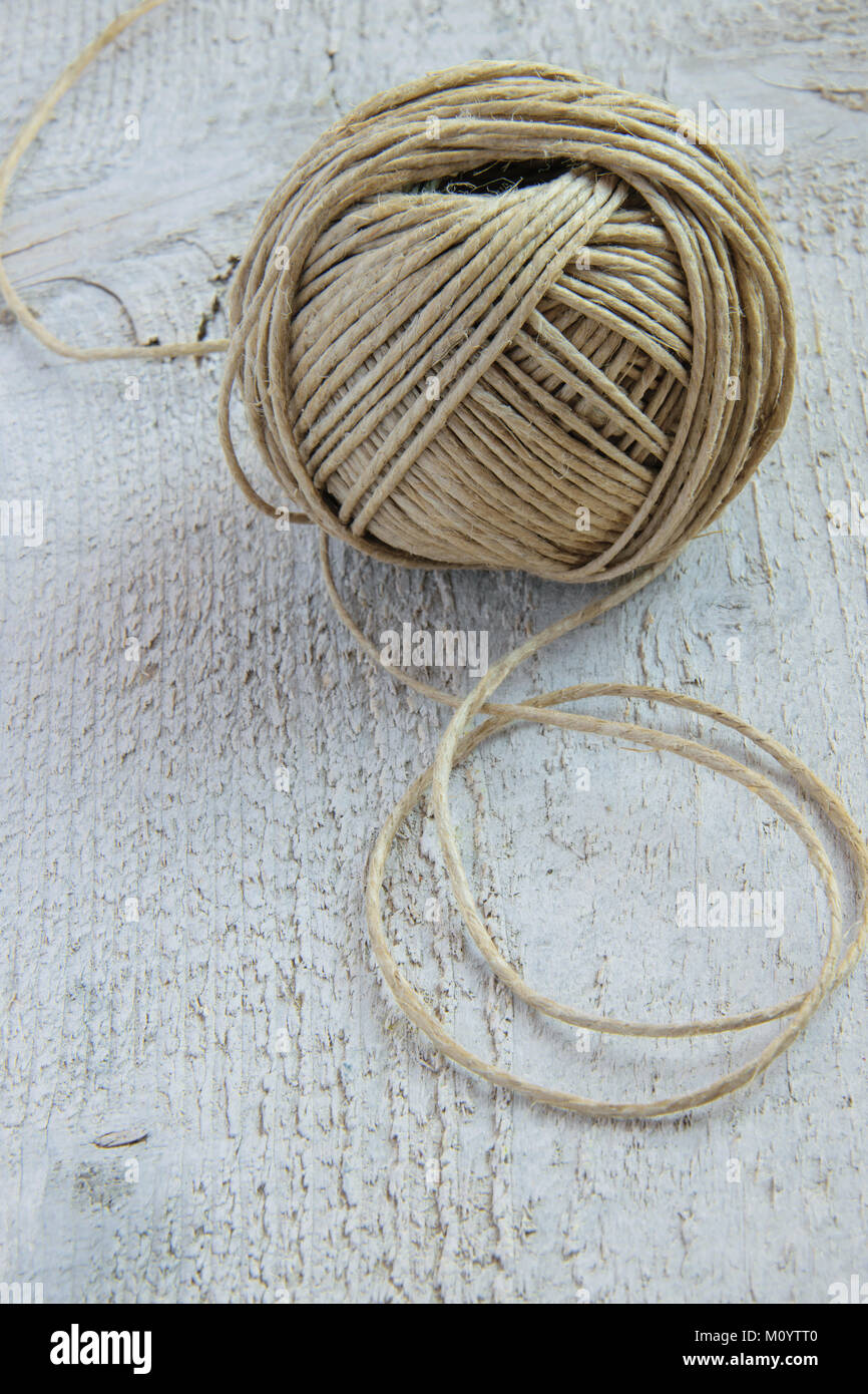 Ball of hemp twine on white wooden background with space for text Stock ...