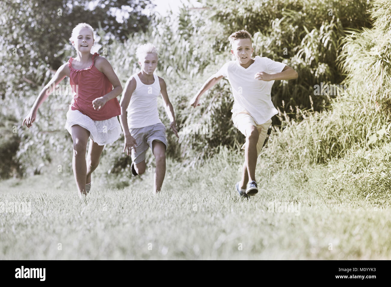 Kids chasing each other hi-res stock photography and images - Alamy