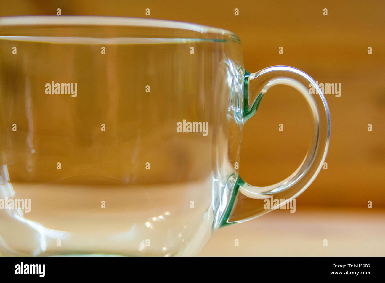 Transparent empty cup on wood background Stock Photo - Alamy