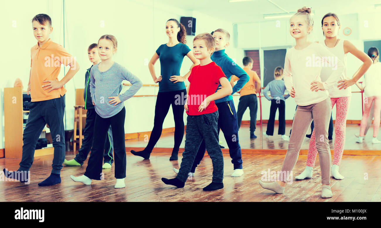 Friendly children studying contemp dance in dancing studio Stock Photo ...