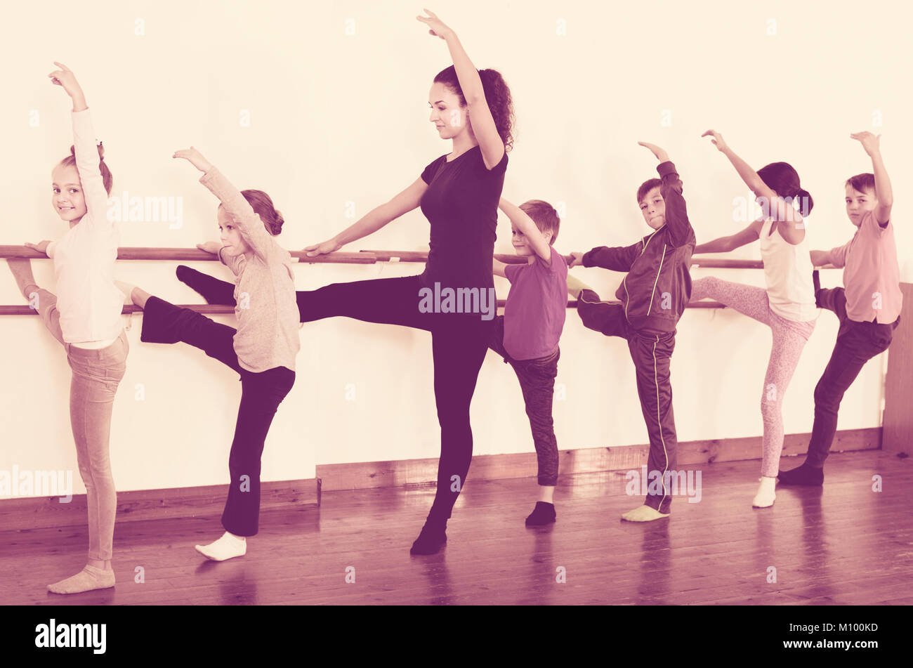 Happy positive ballet dancers exercising in ballroom Stock Photo - Alamy