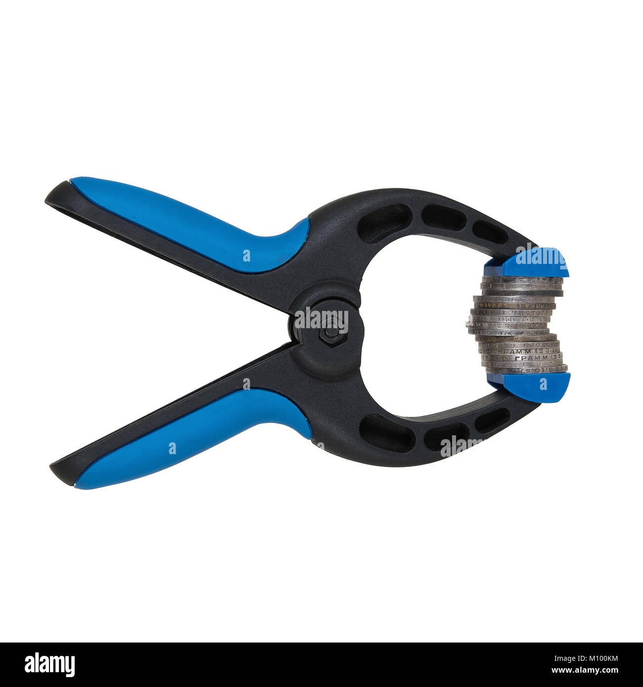 A blue clamp holding silver coins at white background Stock Photo - Alamy