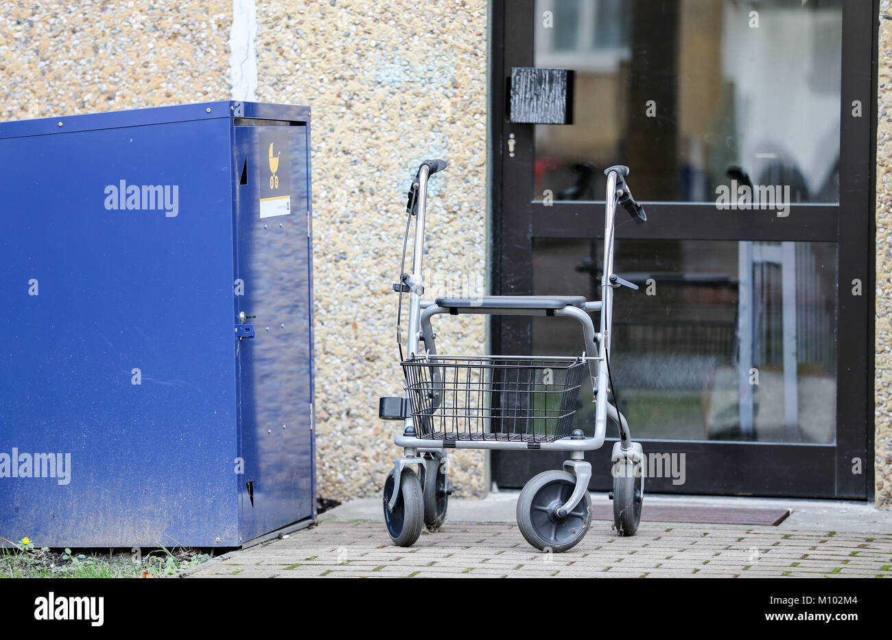 Leipzig, Germany. 24th Jan, 2018. A rollator stands in front of a box ...
