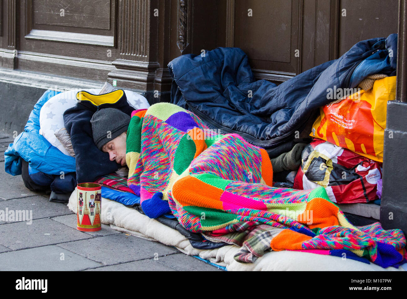 Windsor, UK. 25th Jan, 2018. A rough sleeper on a pavement in front of ...