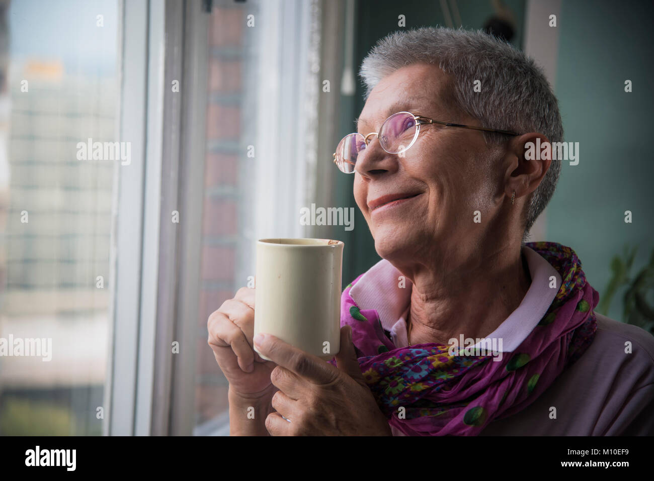 Grandma enjoying her morning coffee Stock Photo - Alamy